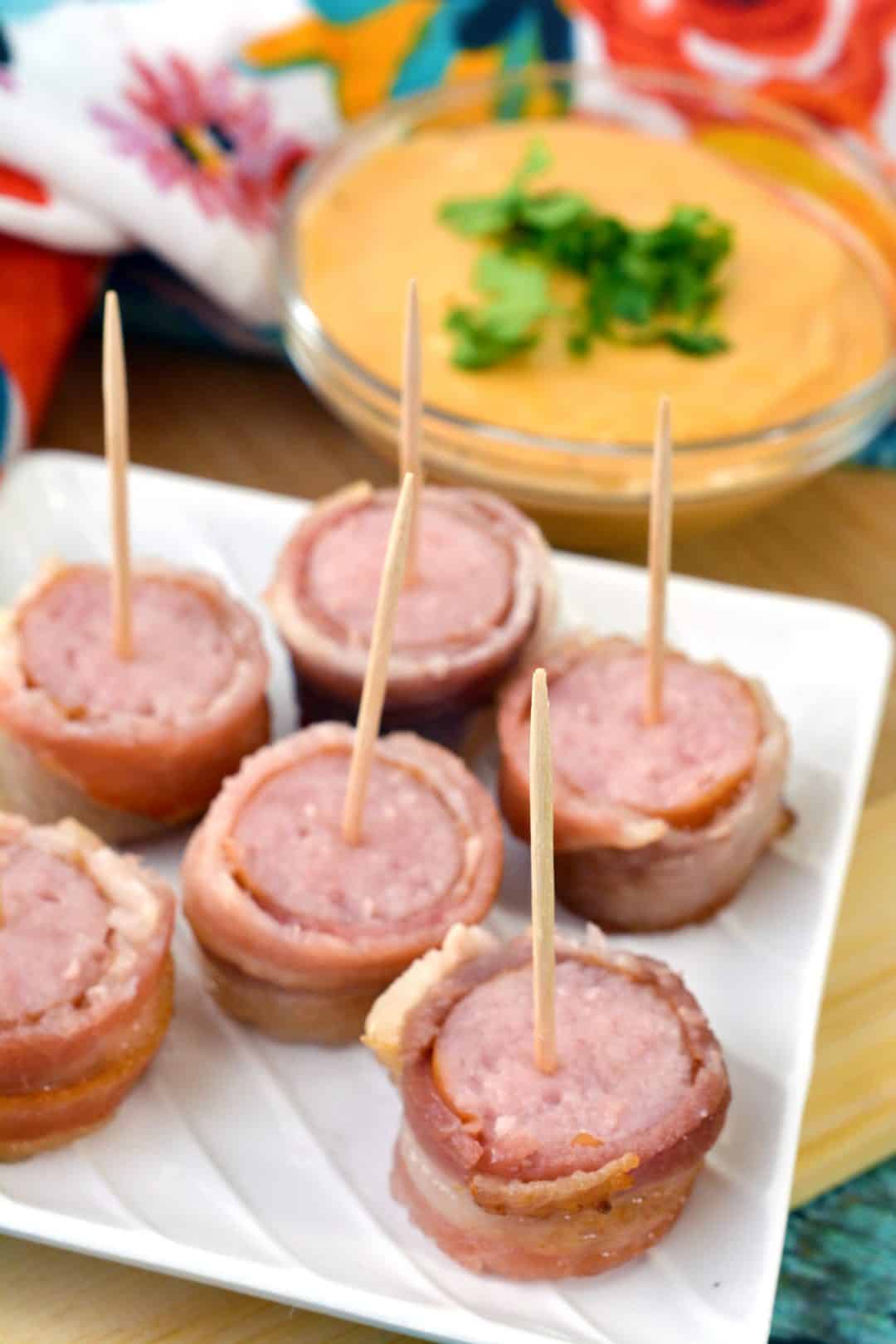 Bacon Wrapped Brats with Beer Cheese Sauce - CheekyKitchen