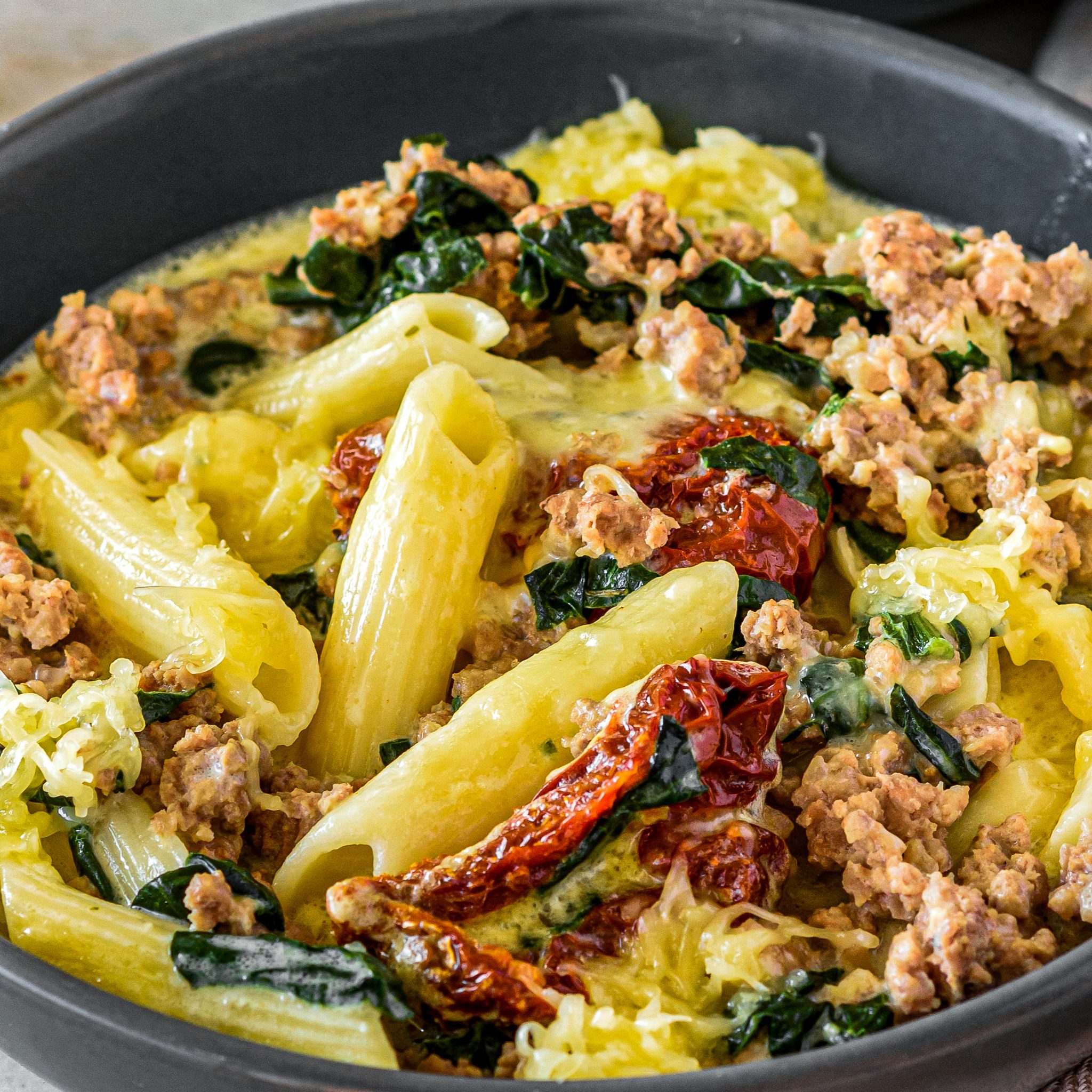 Creamy Tuscan Sausage Pasta Recipe - CheekyKitchen